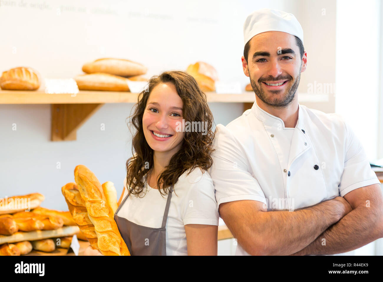 Team of bakers working at the bakery Stock Photo - Alamy