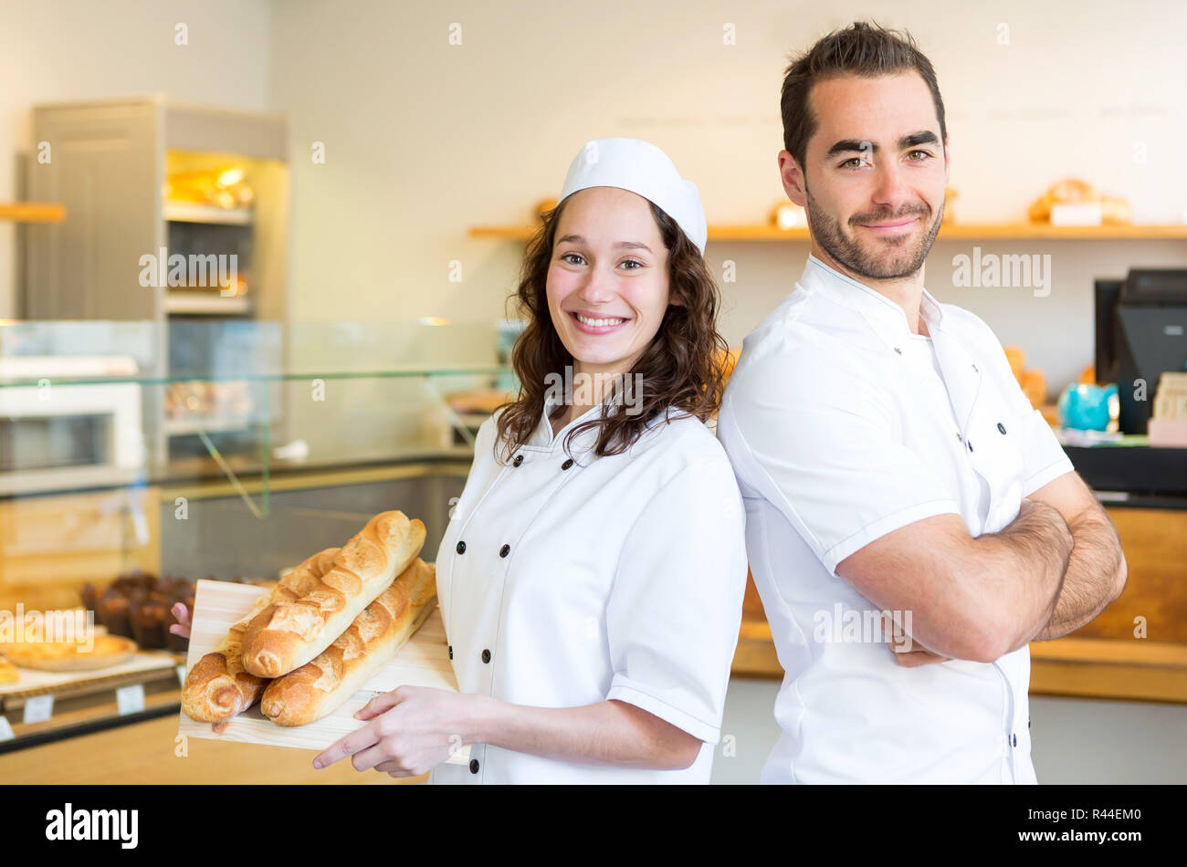 Team of bakers working at the bakery Stock Photo - Alamy