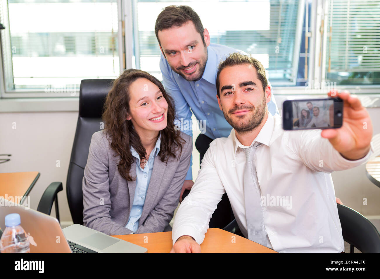 Group of business associates working together at the office Stock Photo ...