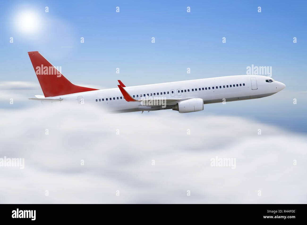 PlaneÂ flying over the clouds Stock Photo - Alamy