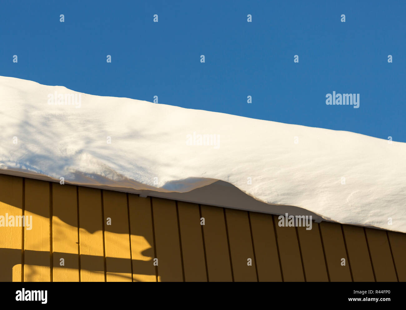 Snow Sheet Hanging from Roof Stock Photo - Alamy