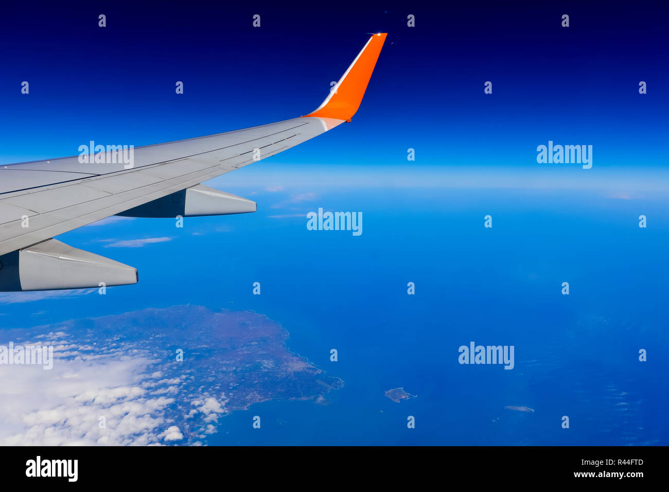 airplane wing over the blue cloud sky Stock Photo - Alamy
