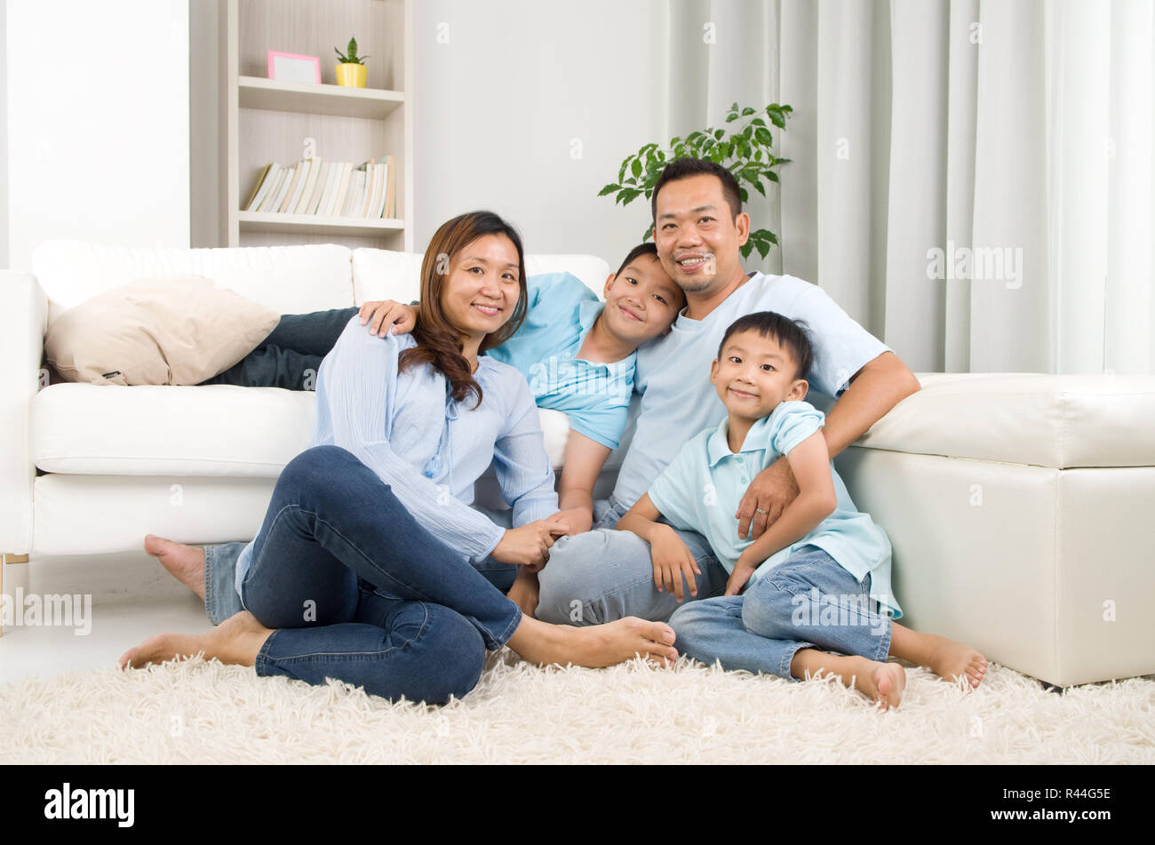 Asian family with kids look camera hi-res stock photography and images ...
