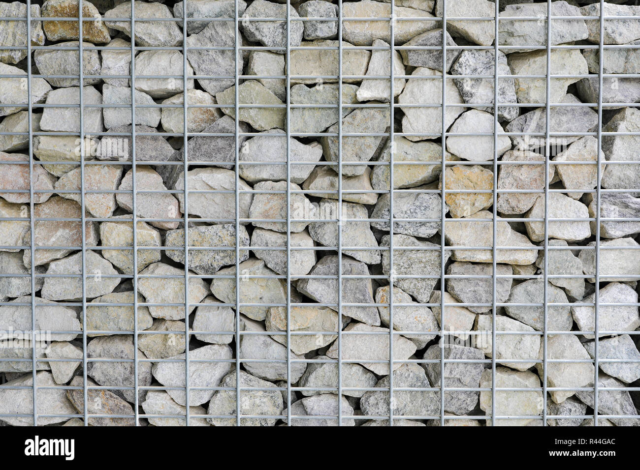 wall stone with steel net Stock Photo - Alamy