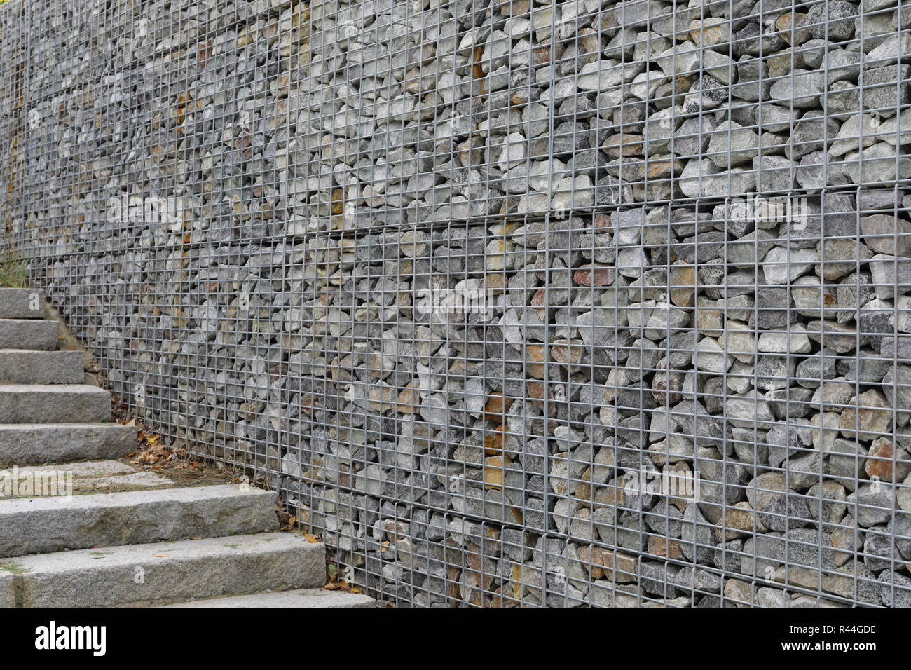 wall stone with steel net Stock Photo - Alamy