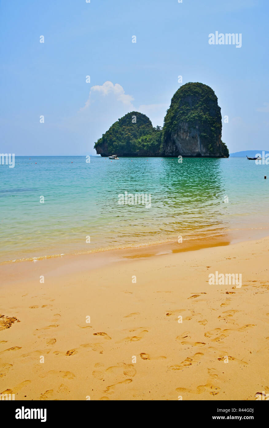 Paradise tropical sand sea beach with rock Stock Photo - Alamy