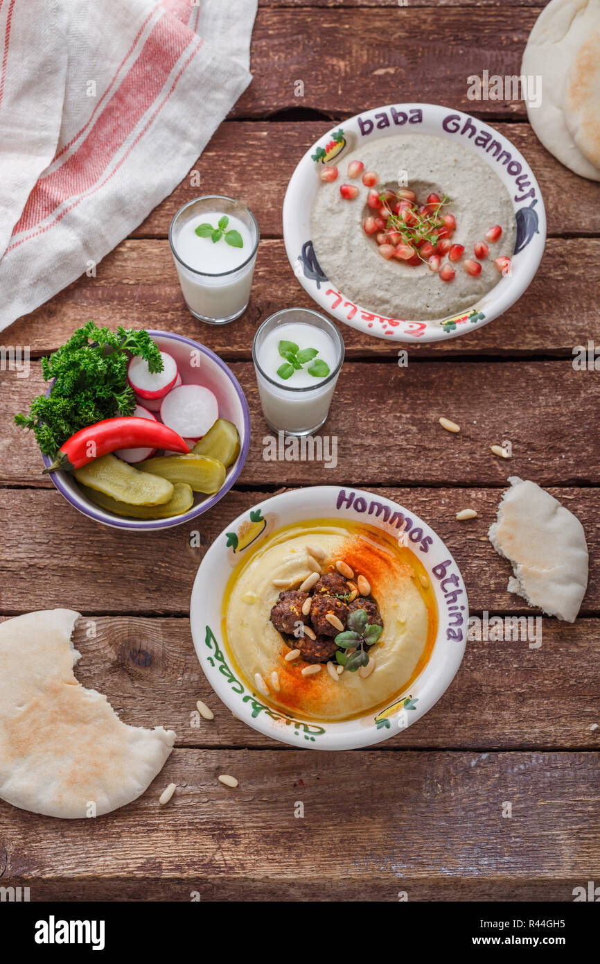 Traditional lebanon appetizers hummus, baba ganoush, vegetables and ...