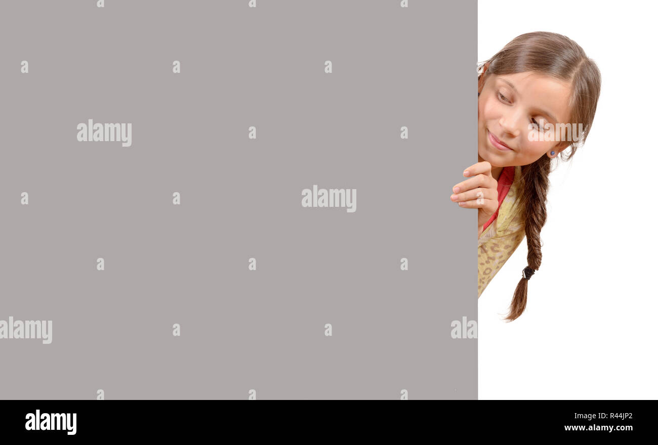 Beautiful young girl with a blank poster isolated on white background ...