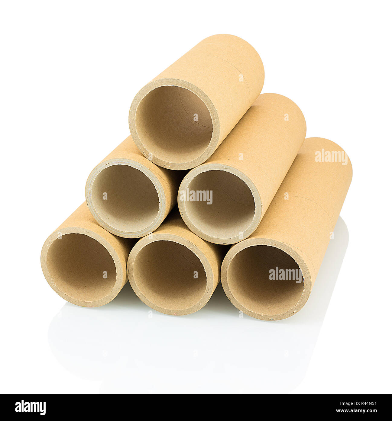 A bunch of brown industrial paper core isolated on white background ...