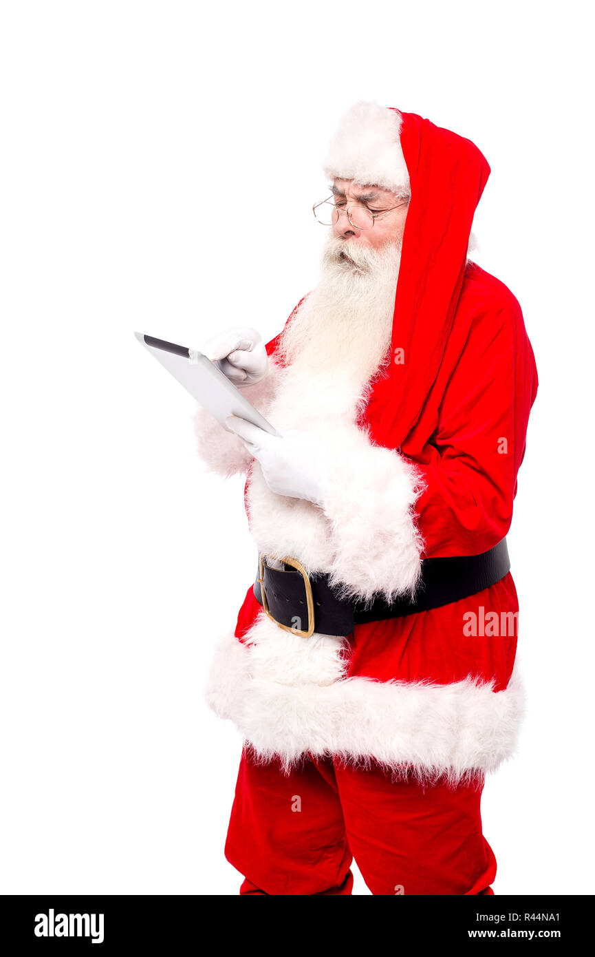 Santa selecting options while surfing Stock Photo - Alamy