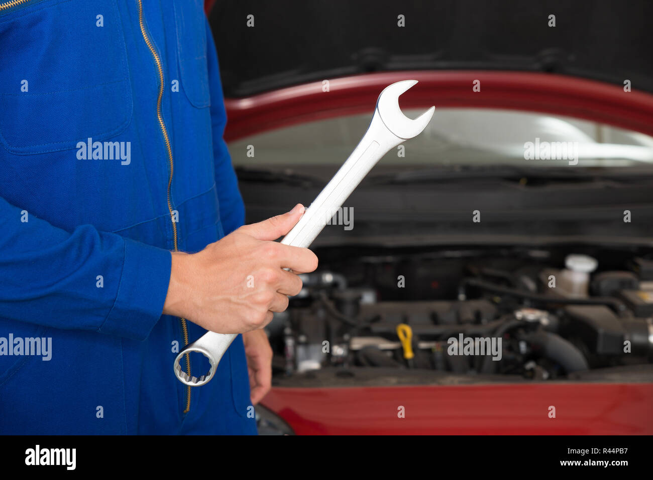 Mechanic Holding Tool Stock Photo - Alamy