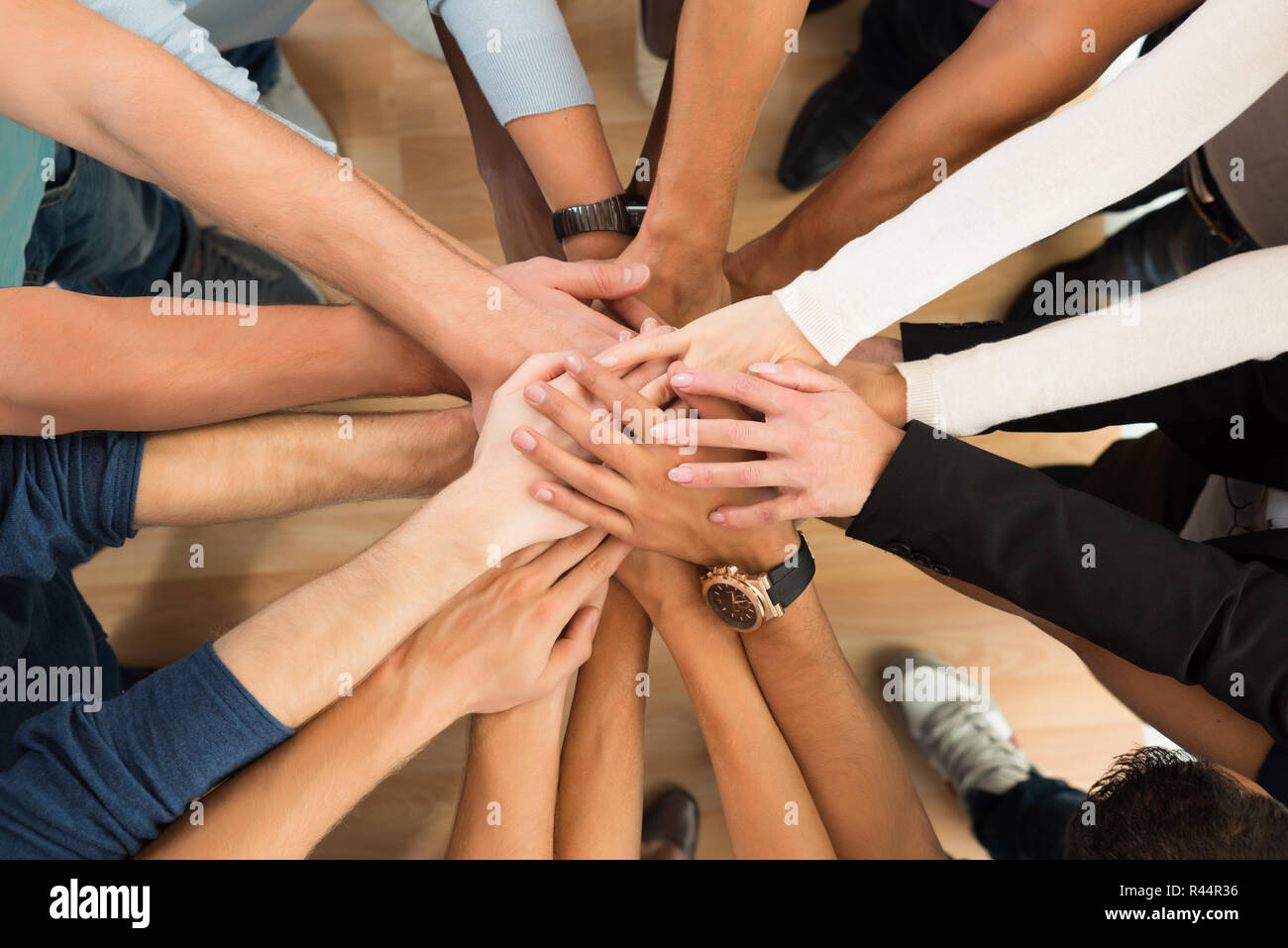 Creative Business People Piling Hands Over White Background Stock Photo ...