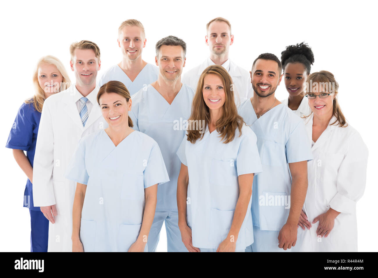 Happy Medical Team Standing Against White Background Stock Photo - Alamy
