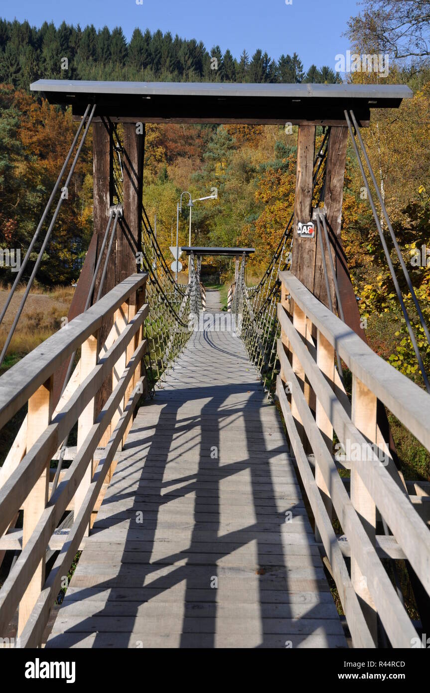 suspension bridge over the agger in oberbergi country Stock Photo - Alamy