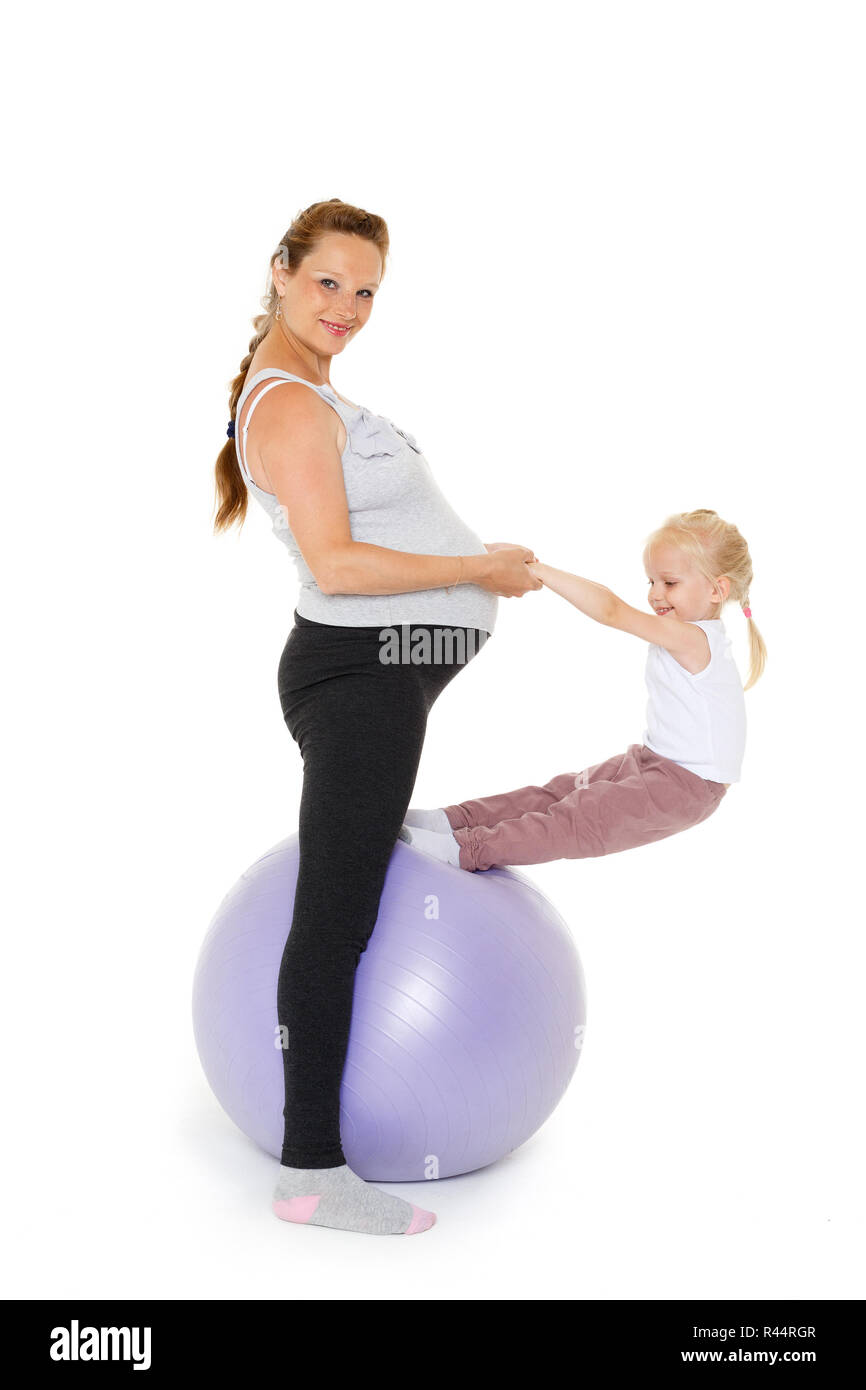 Happy family with fitness ball Stock Photo - Alamy