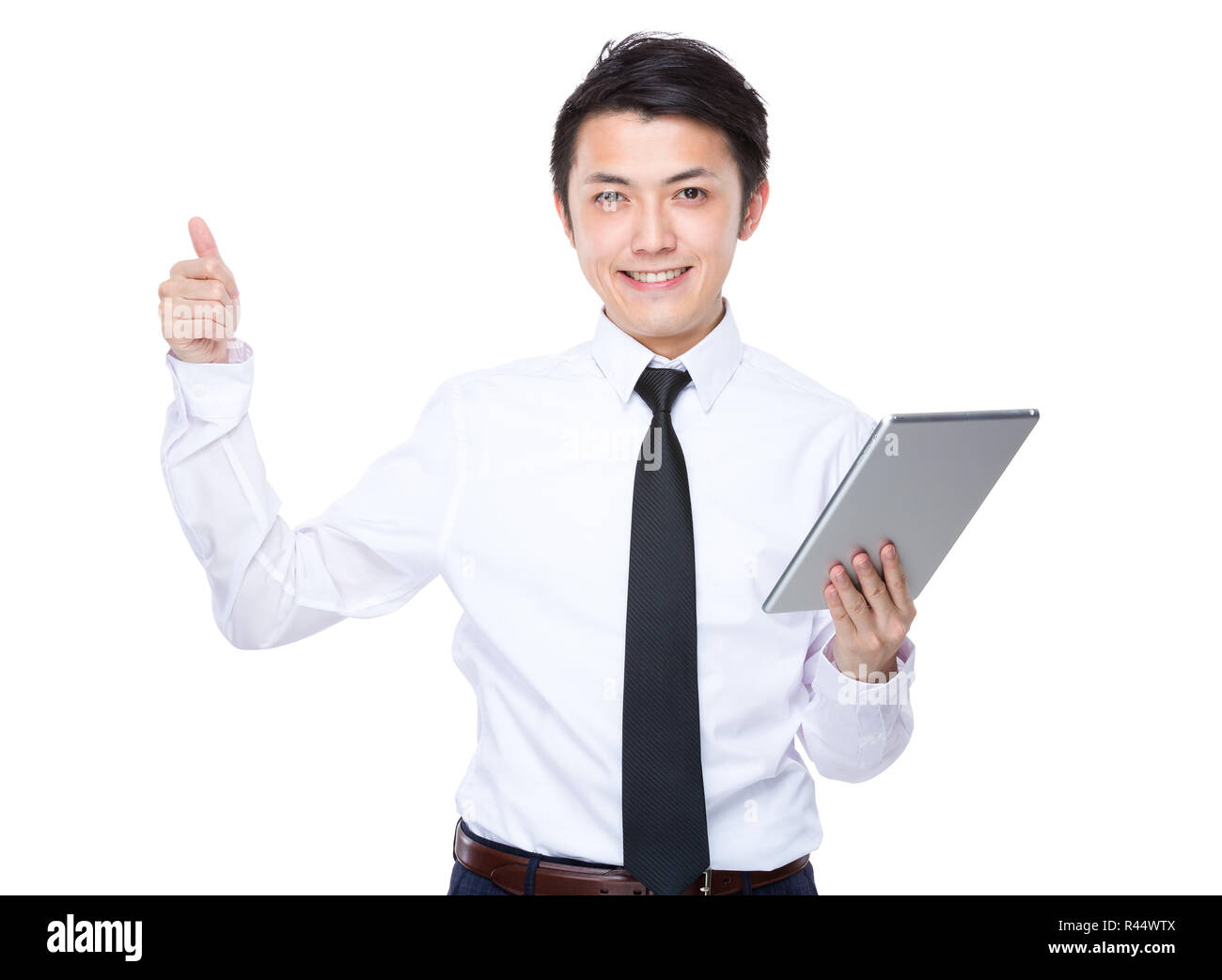 Businessman use of tablet and thumb up Stock Photo - Alamy