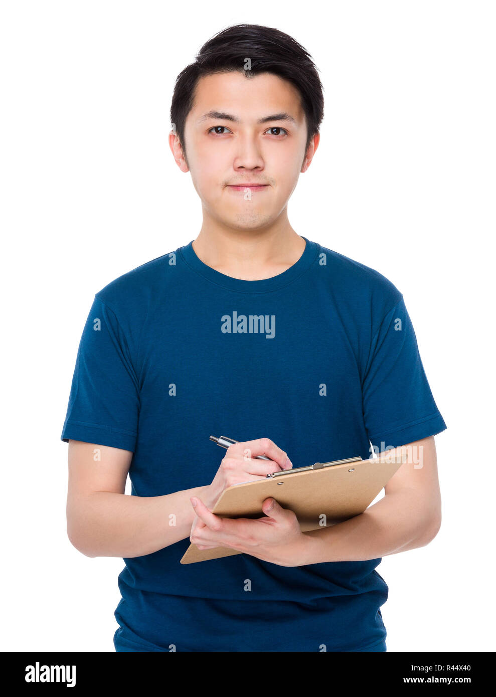 Asian young man write on the clipboard Stock Photo - Alamy