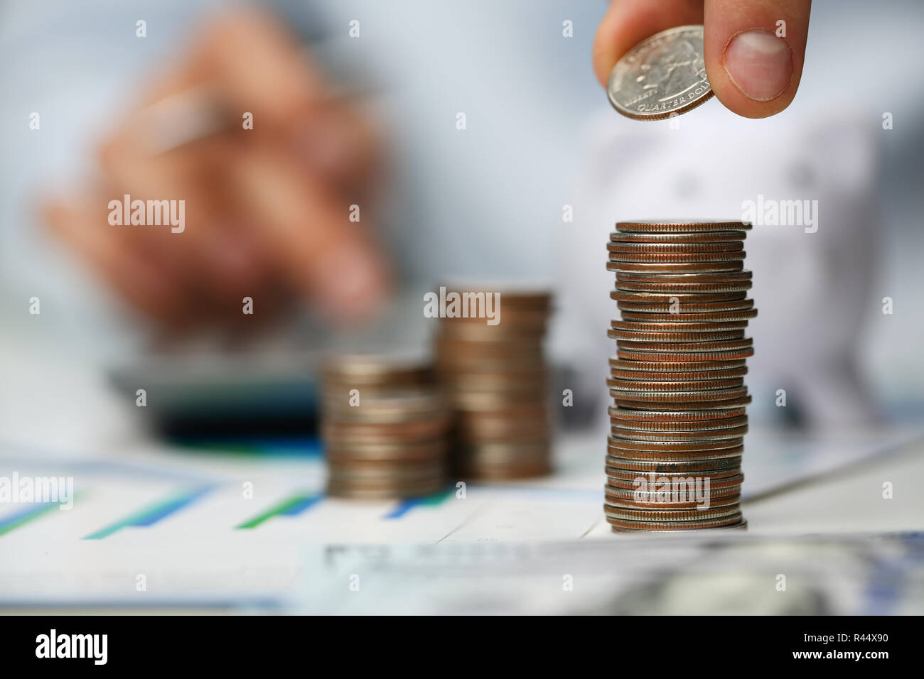Hand businessman putting pin money Stock Photo - Alamy