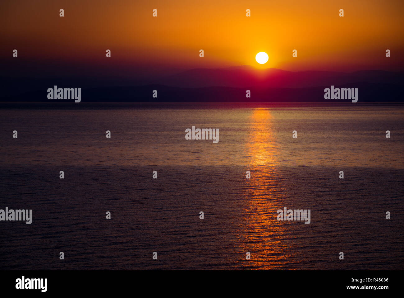 The Rising Sun Over the Sea Stock Photo - Alamy