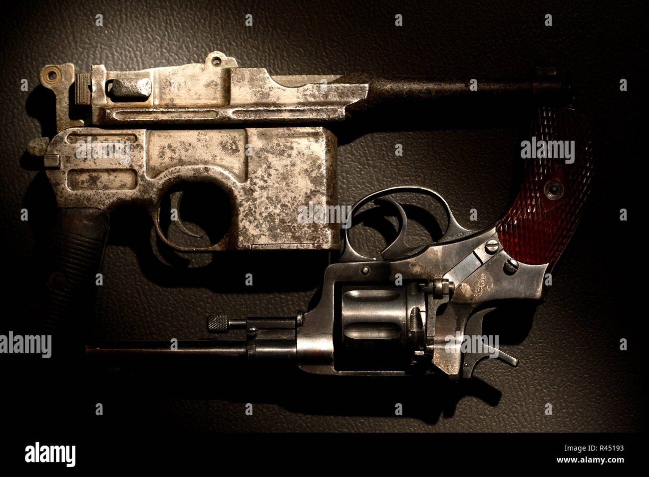 Old revolver and pistol closeup on dark background Stock Photo - Alamy