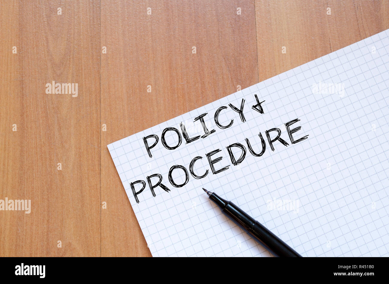 Policy and procedure write on notebook Stock Photo - Alamy