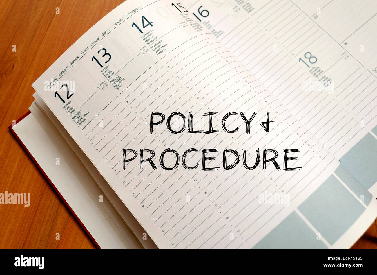 Policy and procedure write on notebook Stock Photo - Alamy