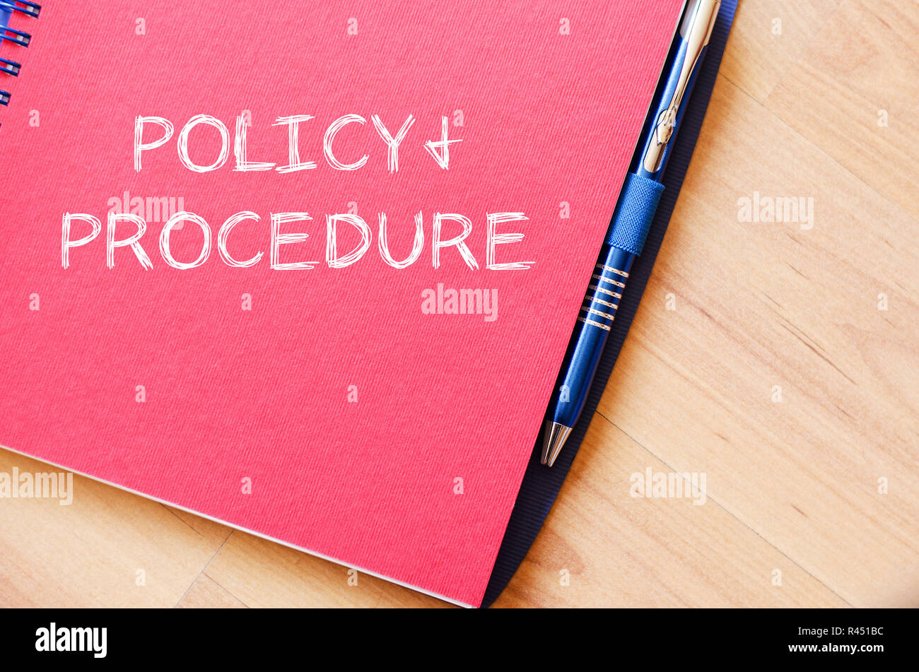 Policy and procedure write on notebook Stock Photo - Alamy