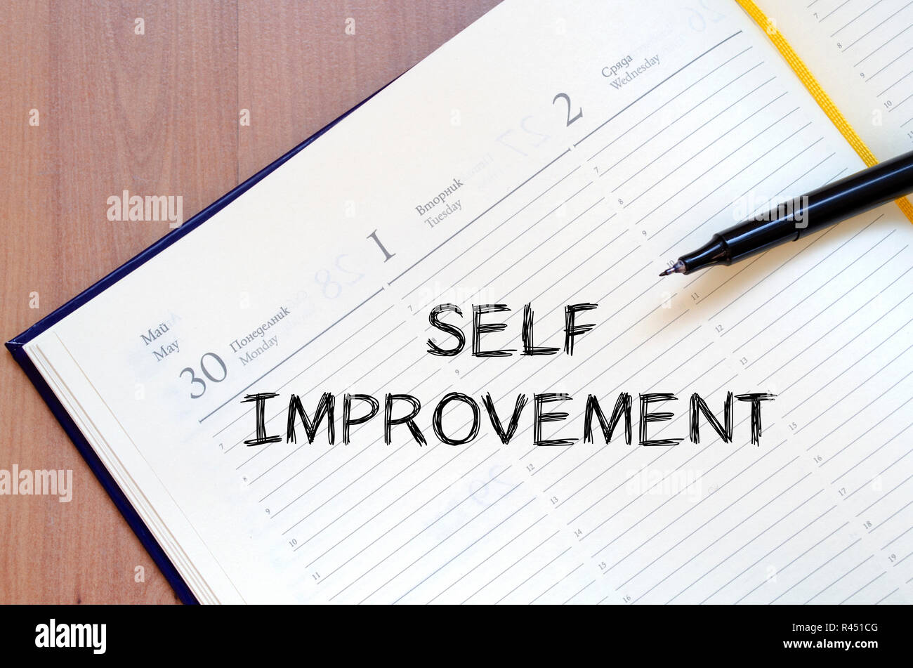 Self improvement write on notebook Stock Photo - Alamy