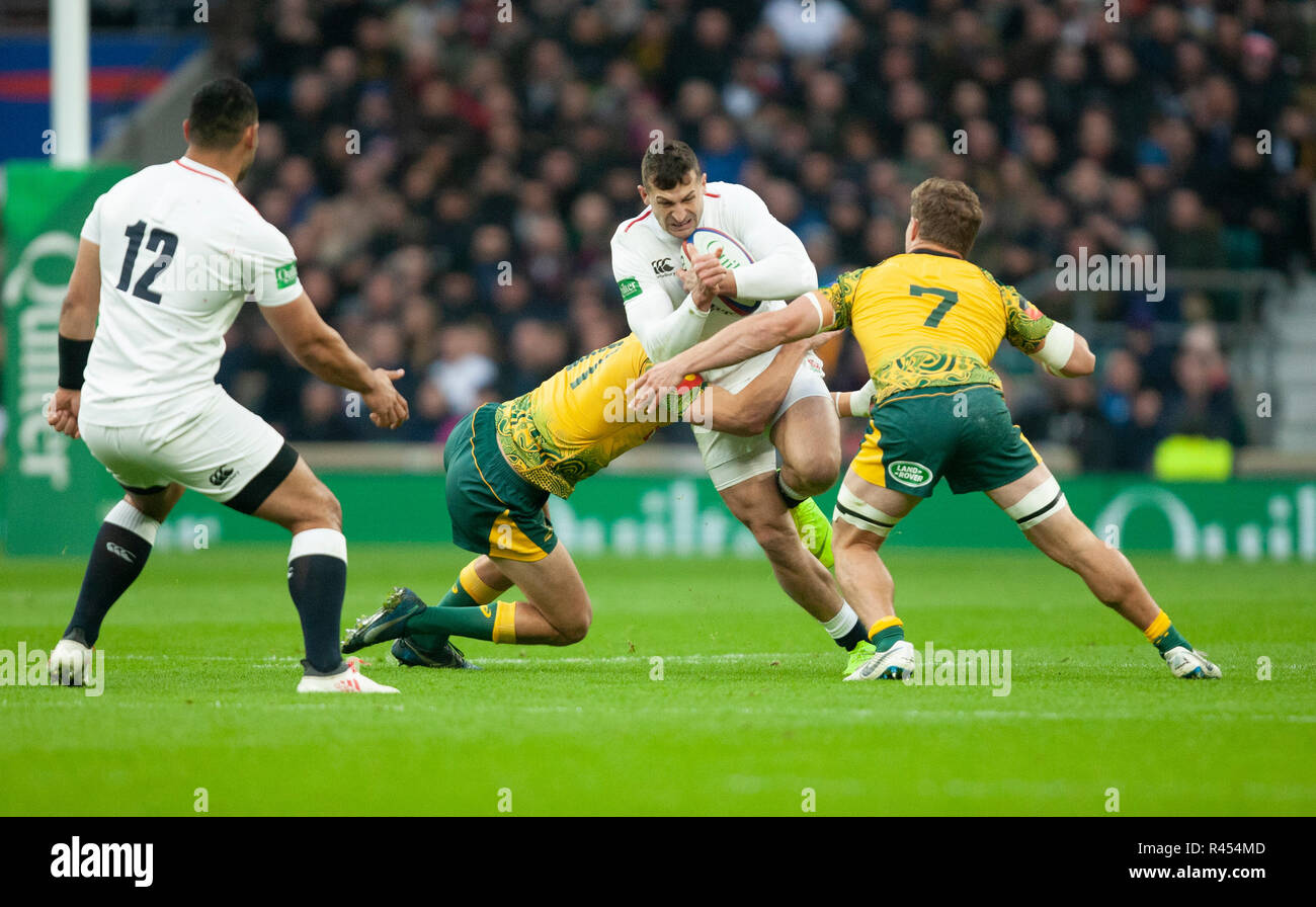 Twickenham, UK. 24th November 2018. England's Jonny May is tackled ...