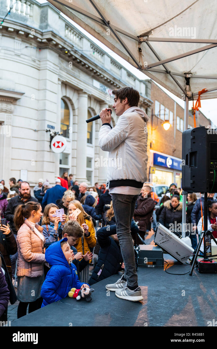 Young teenage man, signer, songwriter, Robbie White, on stage at open ...