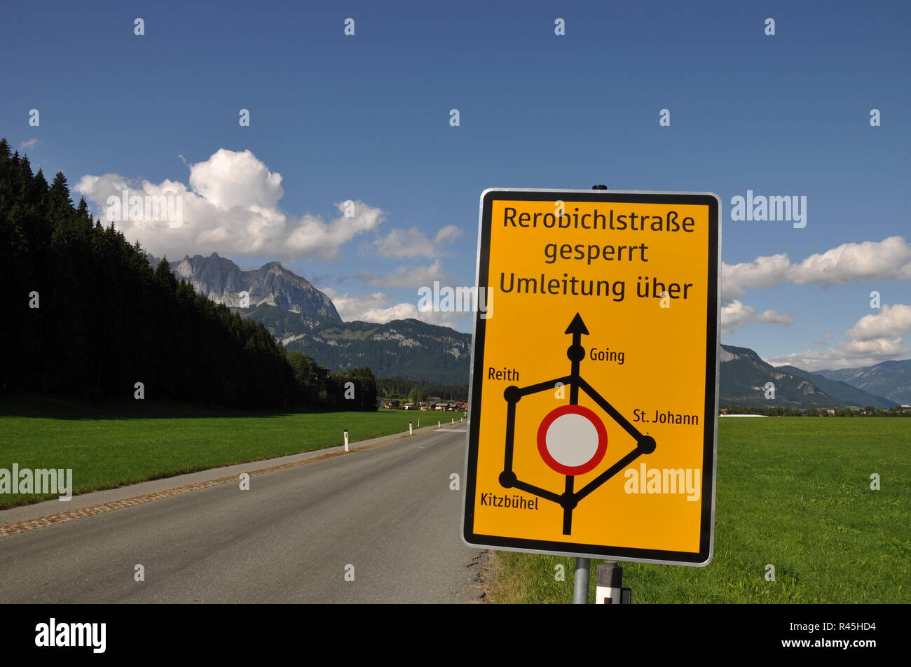 redirection kitzbuhel going sign board traffic sign Stock Photo - Alamy