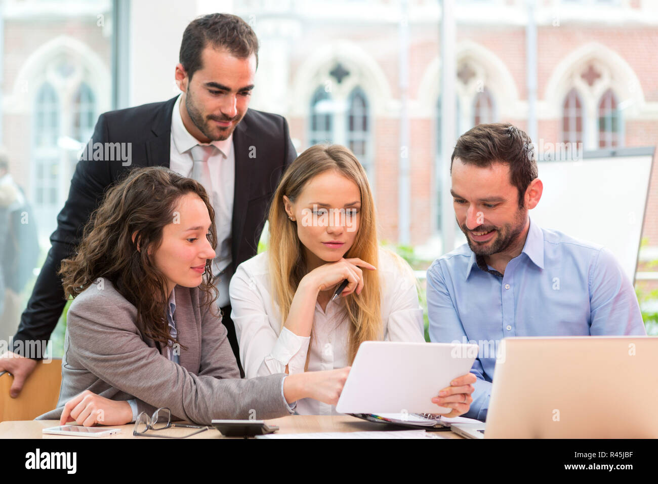 Group of business people working together at the office Stock Photo - Alamy