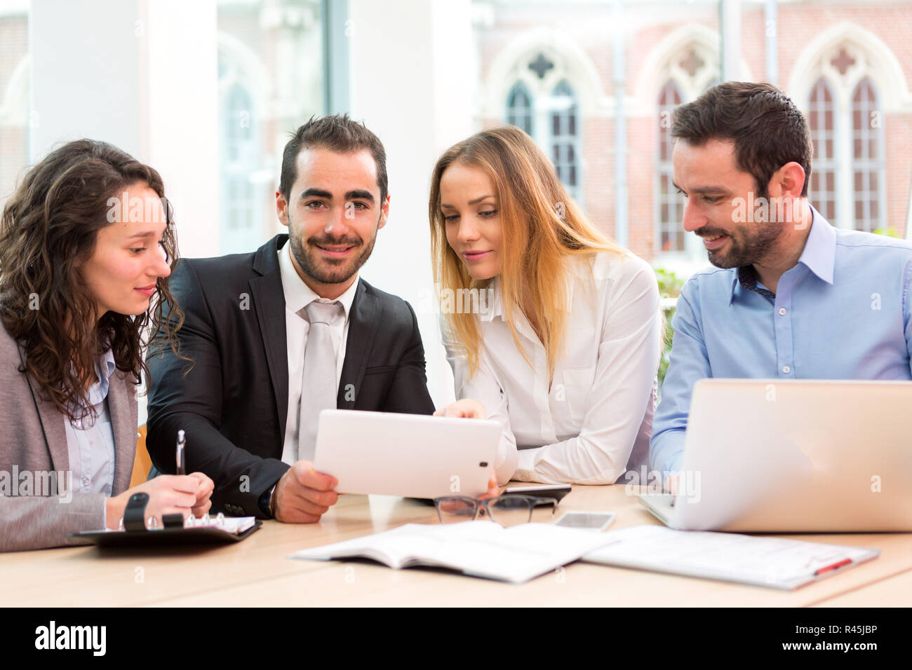 Group of business people working together at the office Stock Photo - Alamy