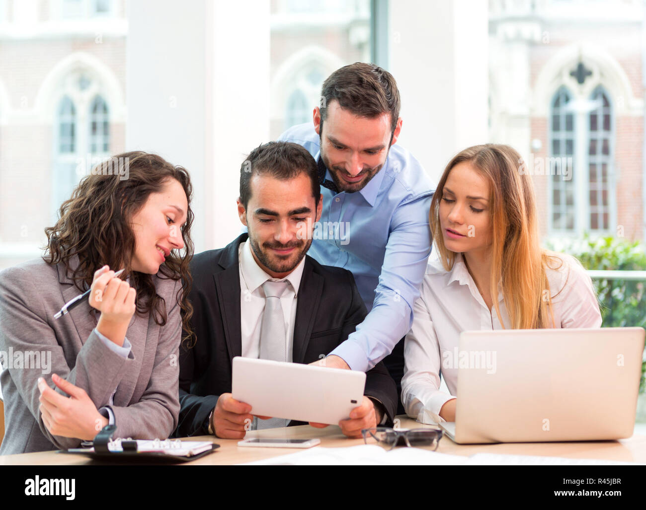 Group of business people working together at the office Stock Photo - Alamy