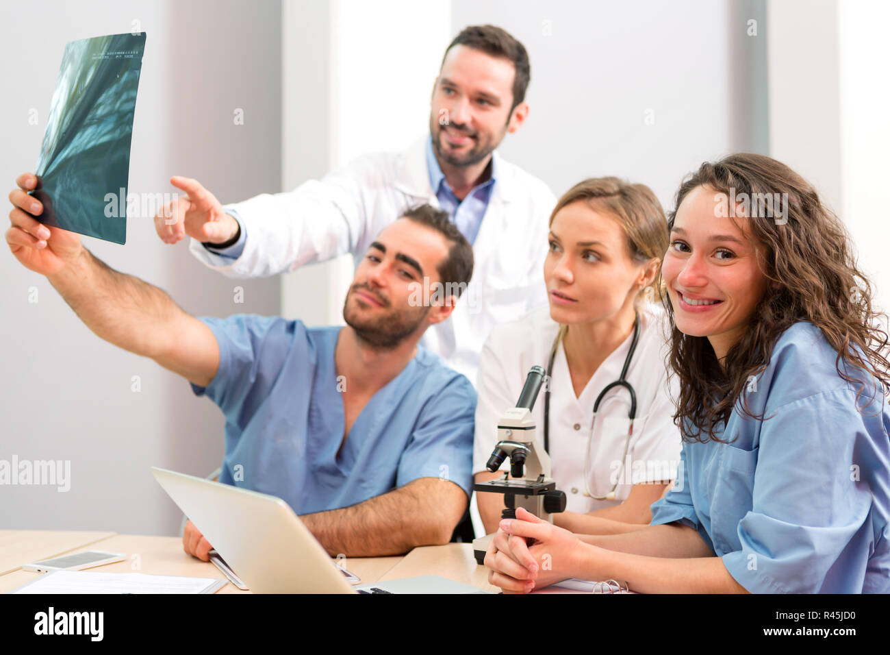 Medical team working at the hospital all together Stock Photo - Alamy