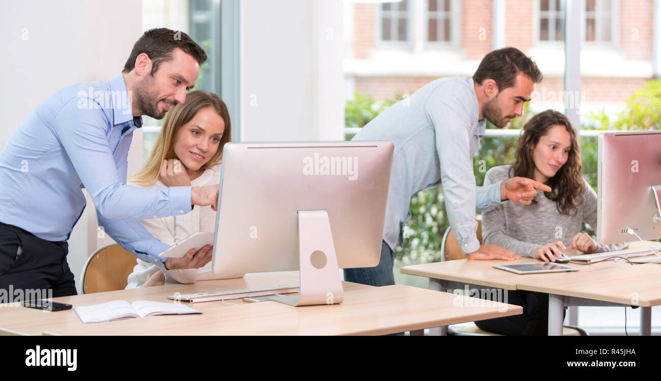 Young attractive people taking a training course with formator Stock ...