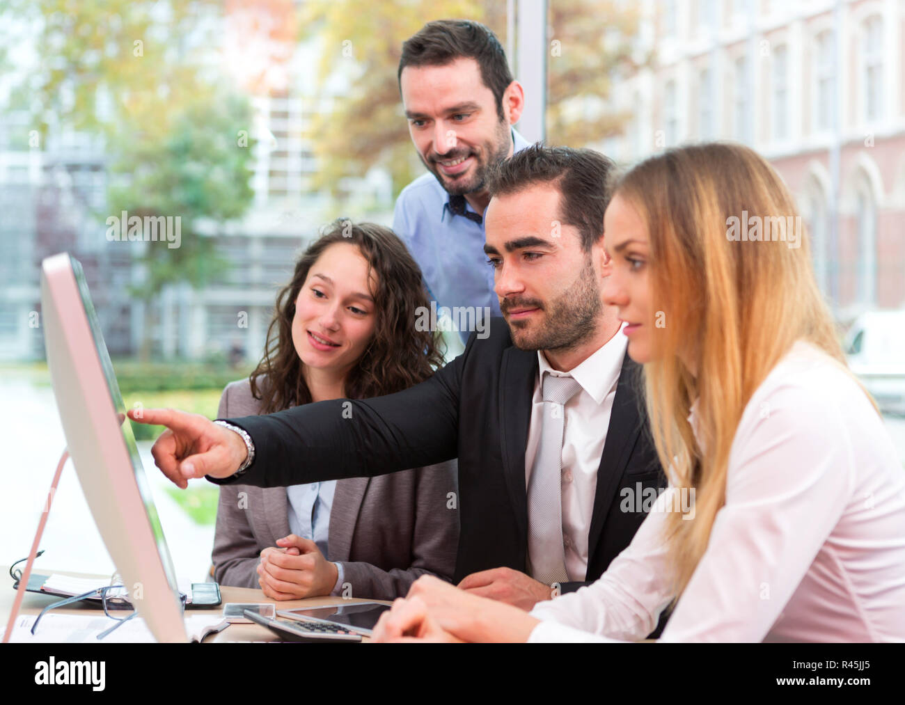 Group of business people working together at the office Stock Photo - Alamy