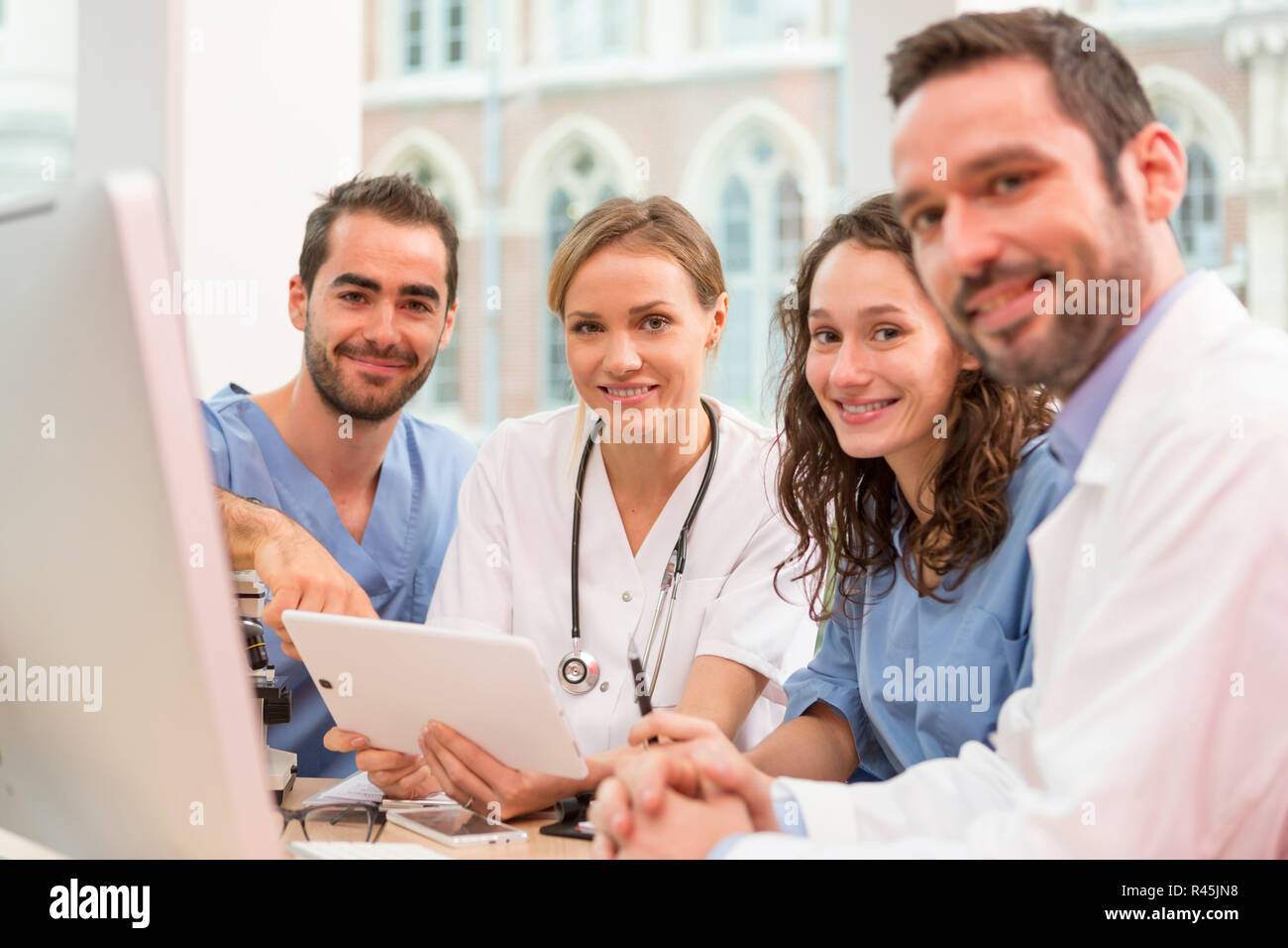 Medical team working at the hospital all together Stock Photo - Alamy