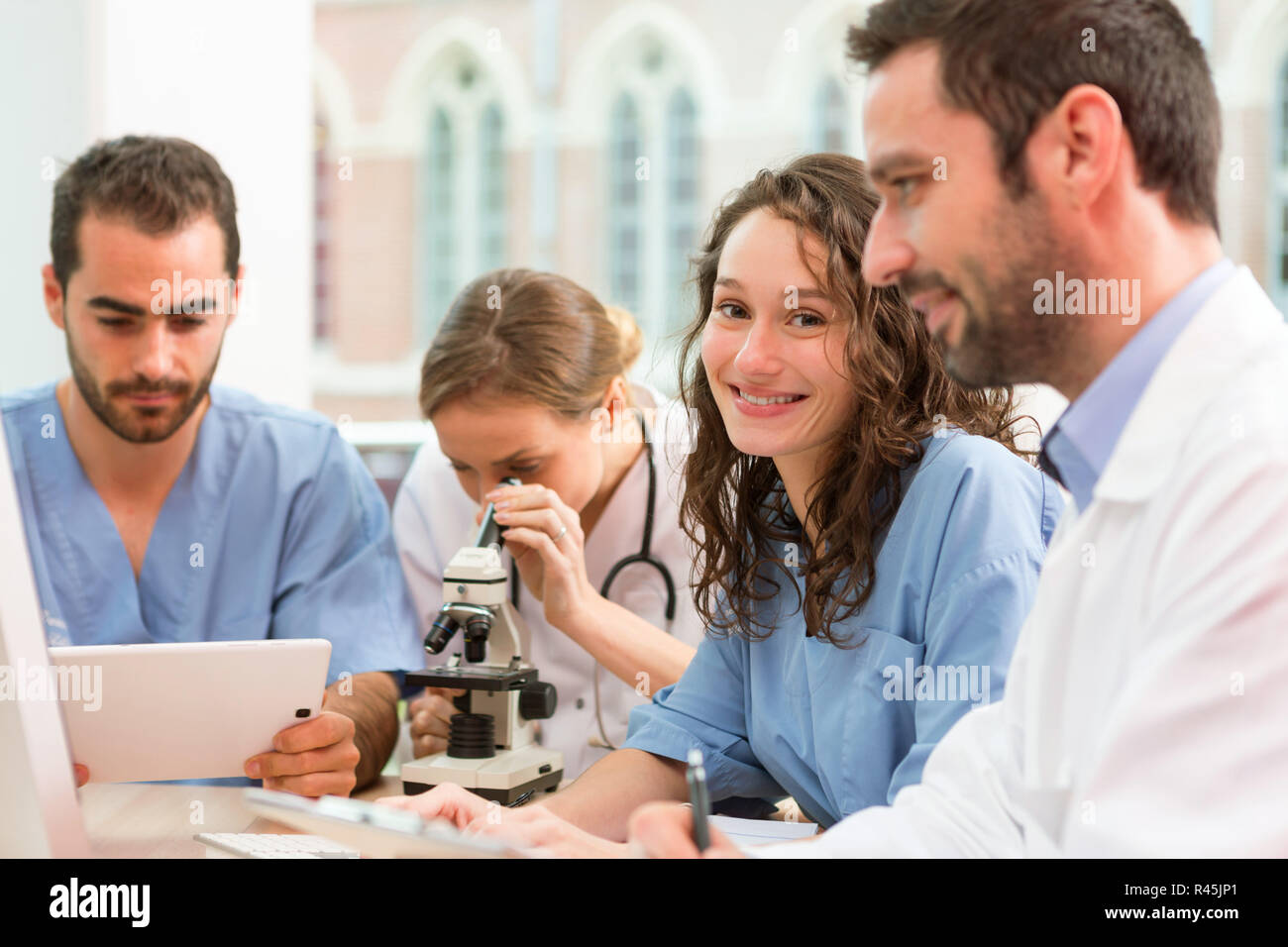 Medical team working at the hospital all together Stock Photo - Alamy