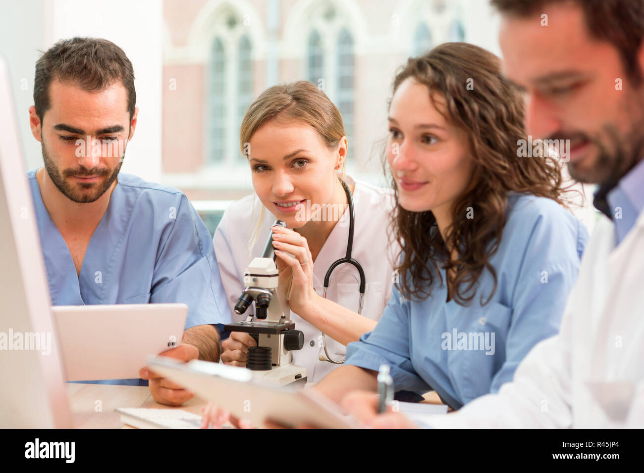 Medical team working at the hospital all together Stock Photo - Alamy