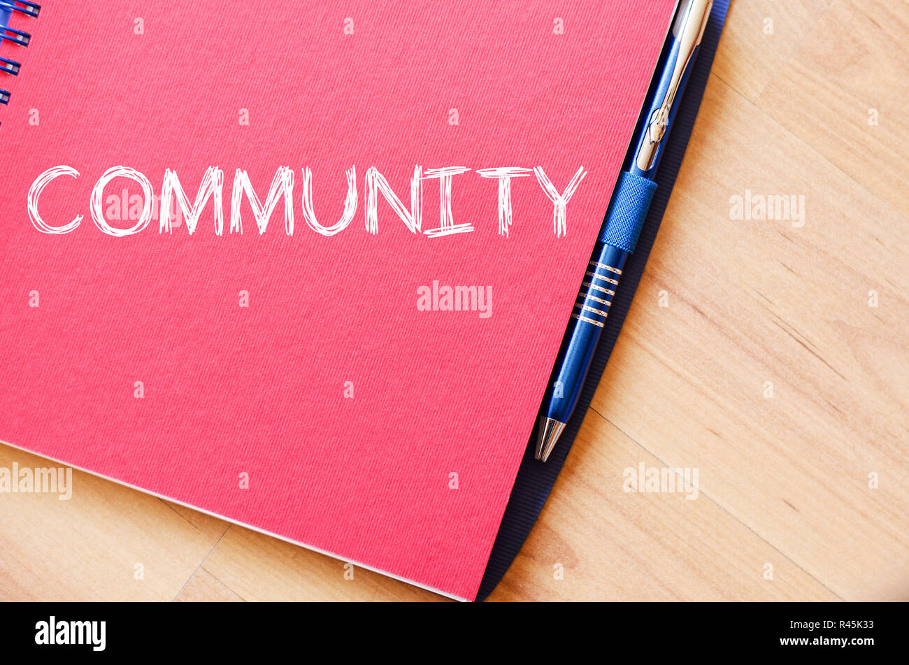 Community write on notebook Stock Photo - Alamy