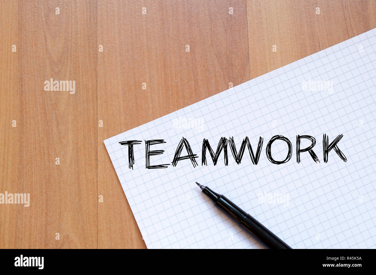 Teamwork write on notebook Stock Photo - Alamy