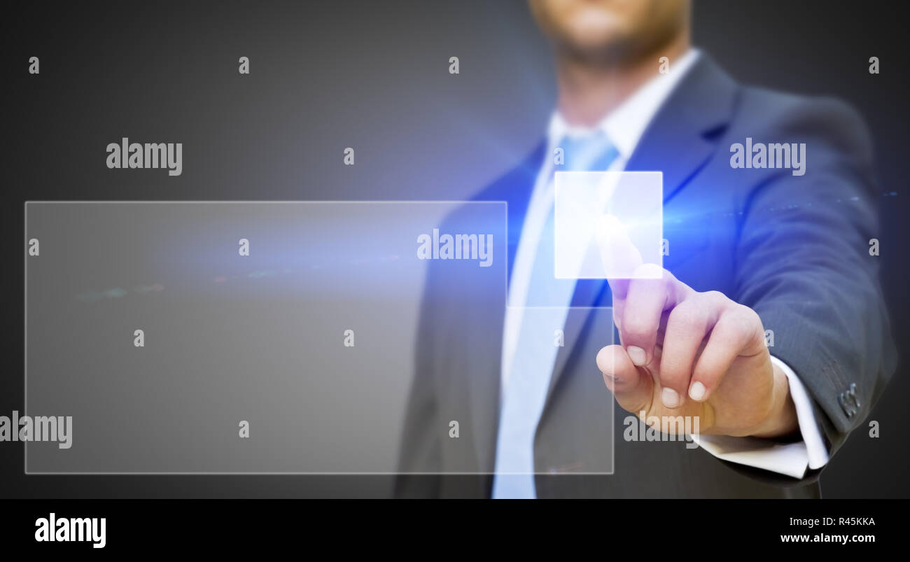 Businessman in his office using tactile interface Stock Photo - Alamy