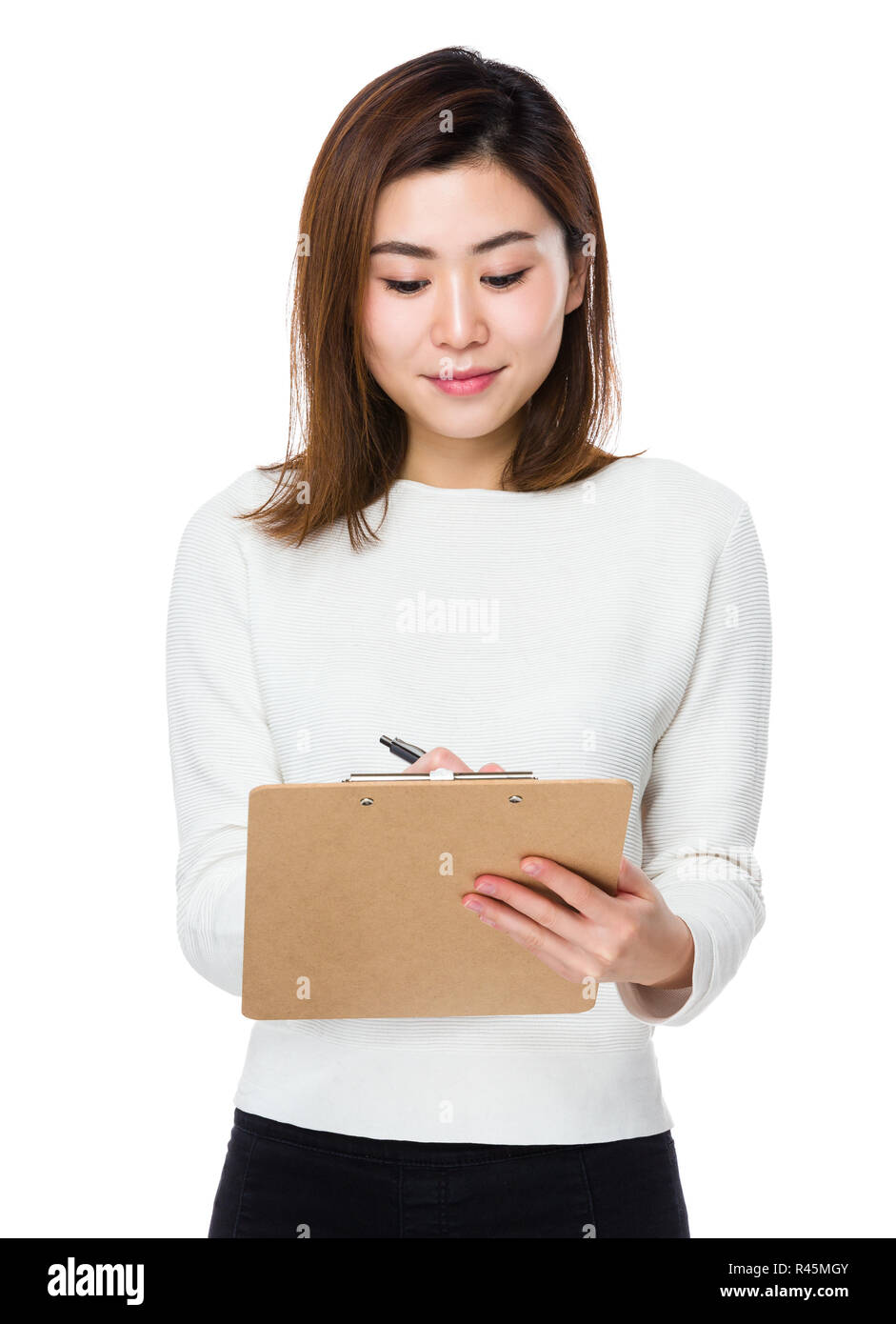 Young woman take note on clipboard Stock Photo - Alamy