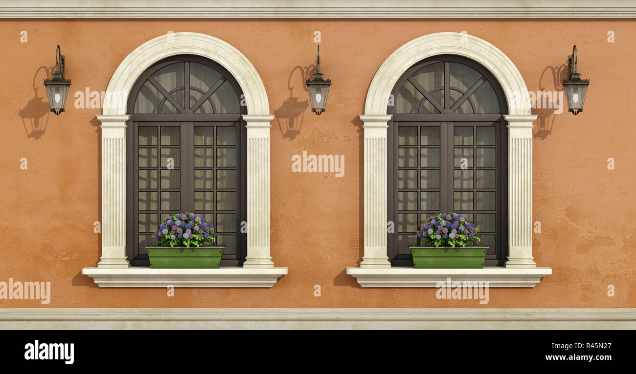 Detail of a facade with two arched windows Stock Photo - Alamy