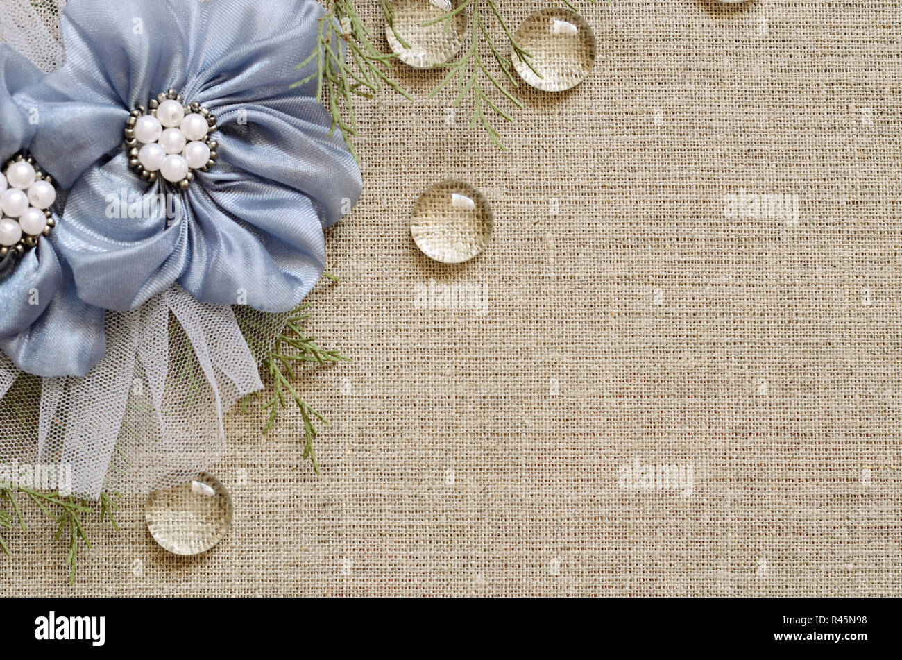 Canvas background with handmade flowers in the corner Stock Photo - Alamy