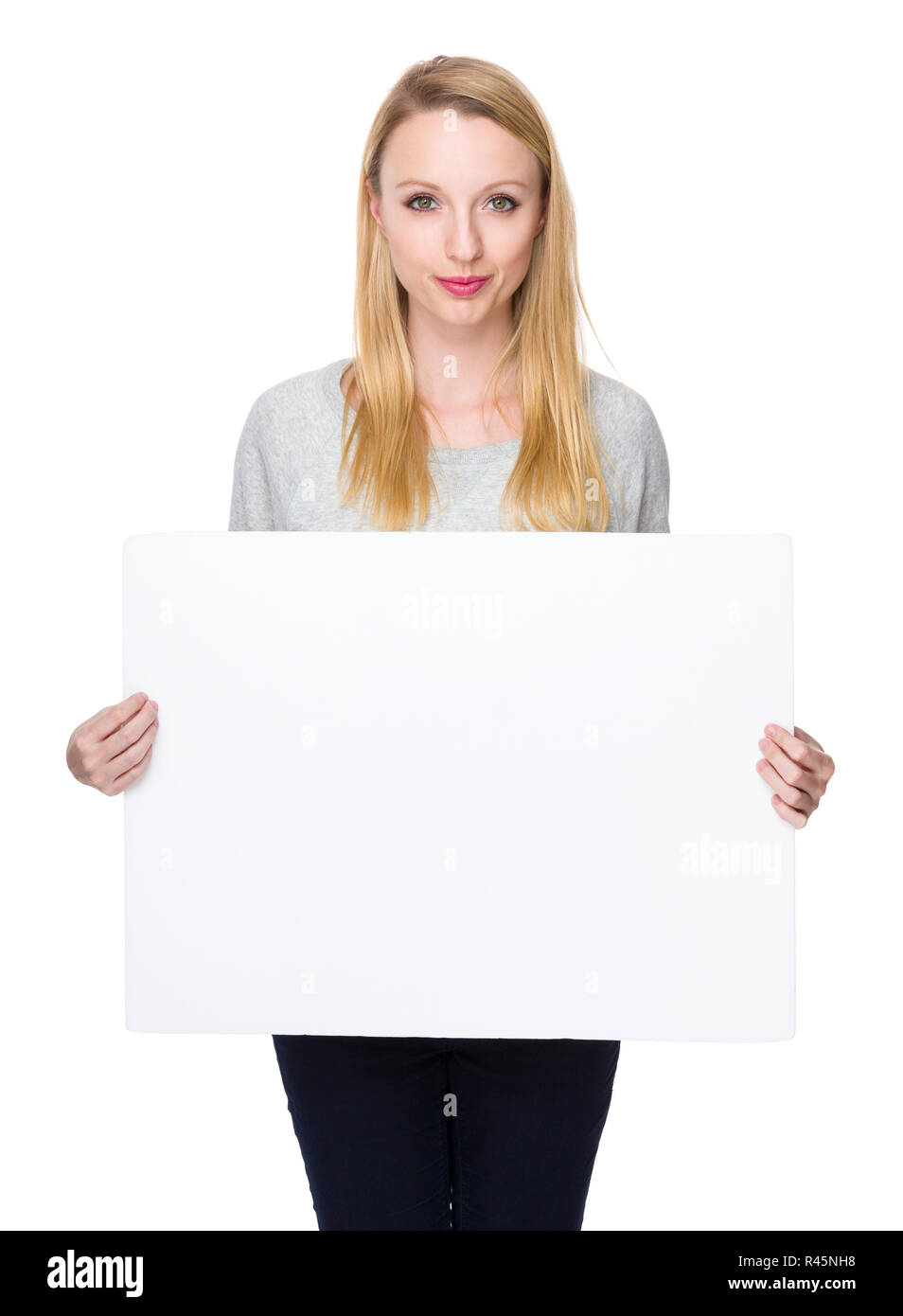 Young Woman show with white banner Stock Photo - Alamy