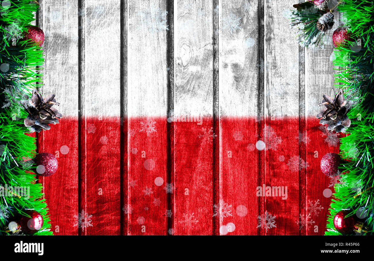 Wooden Christmas background with blurred flag of Poland. There is a ...