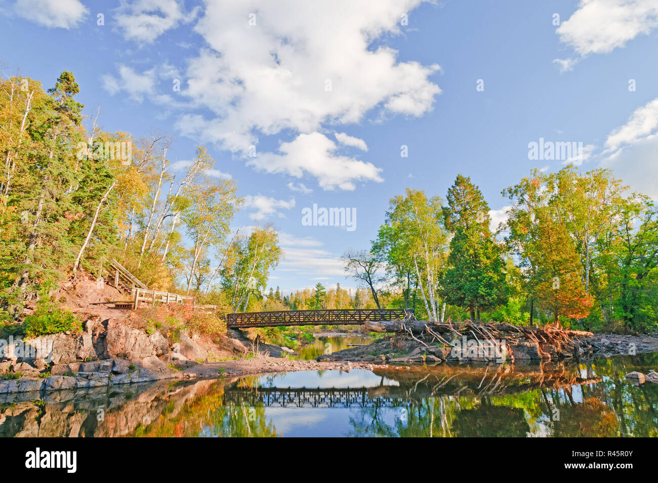 Scenic Bridge over a Quiet Stream Stock Photo - Alamy