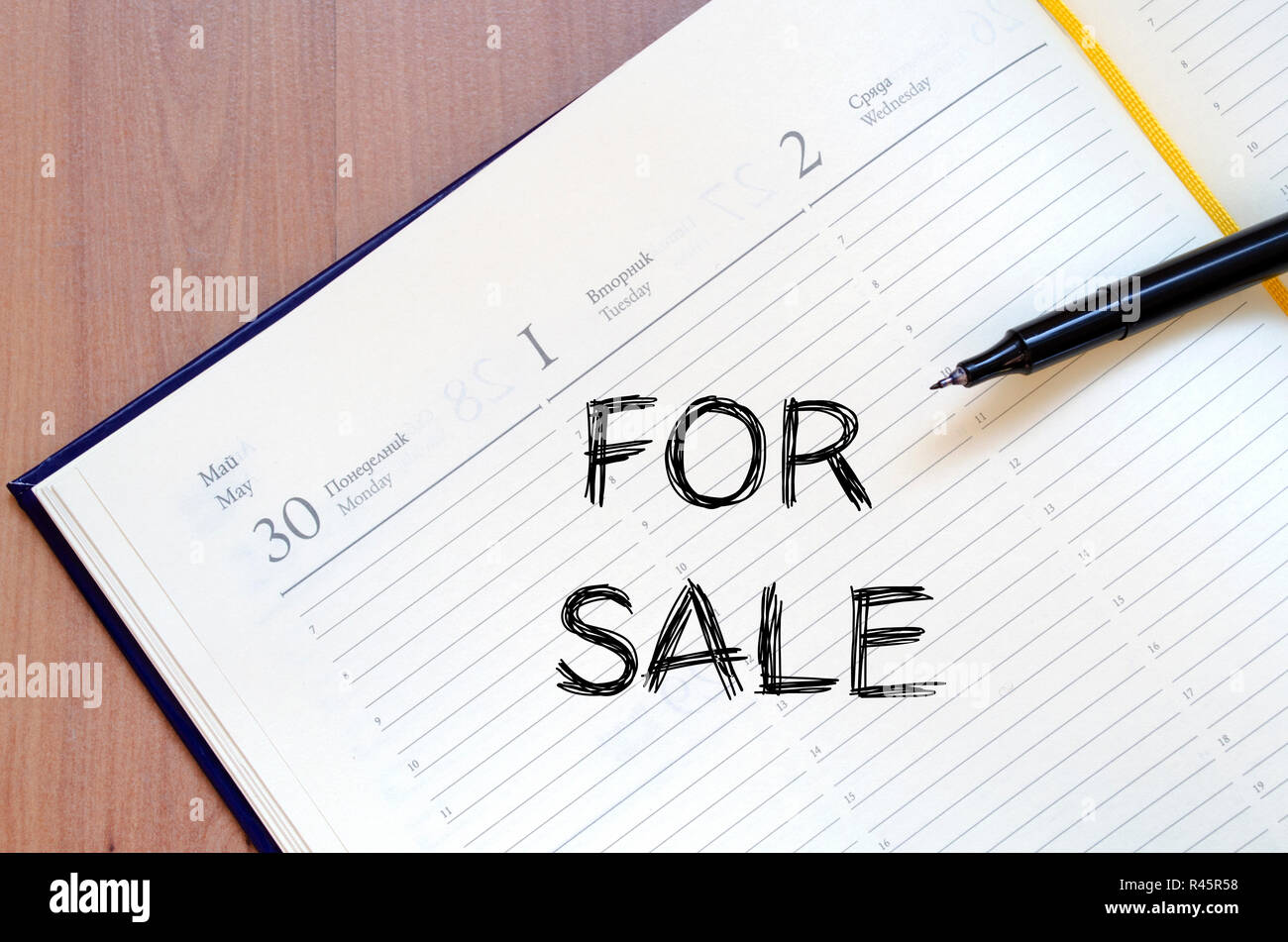 For sale write on notebook Stock Photo - Alamy